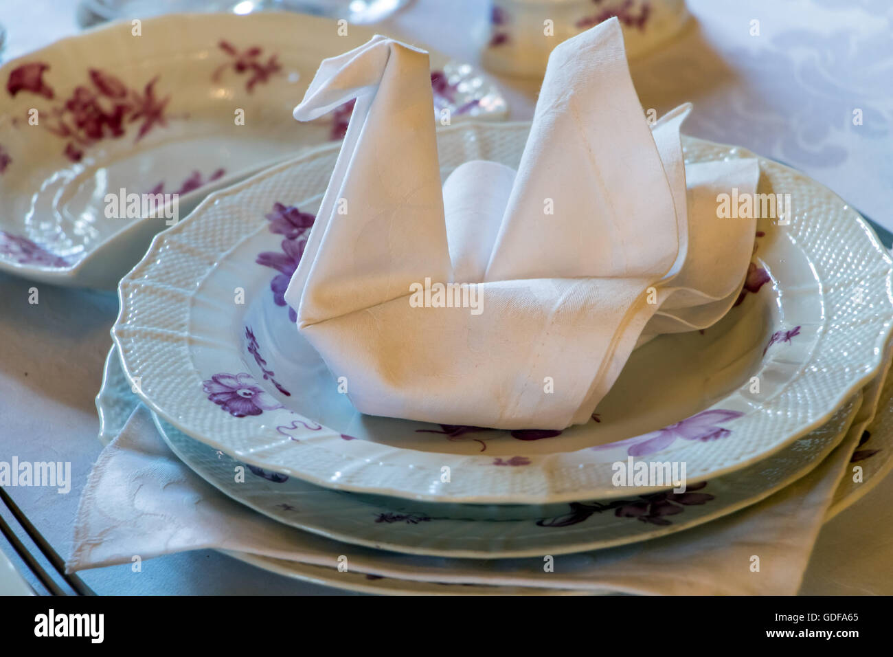 white serviette decoration on ceramic dish for dinner at restaurant ...