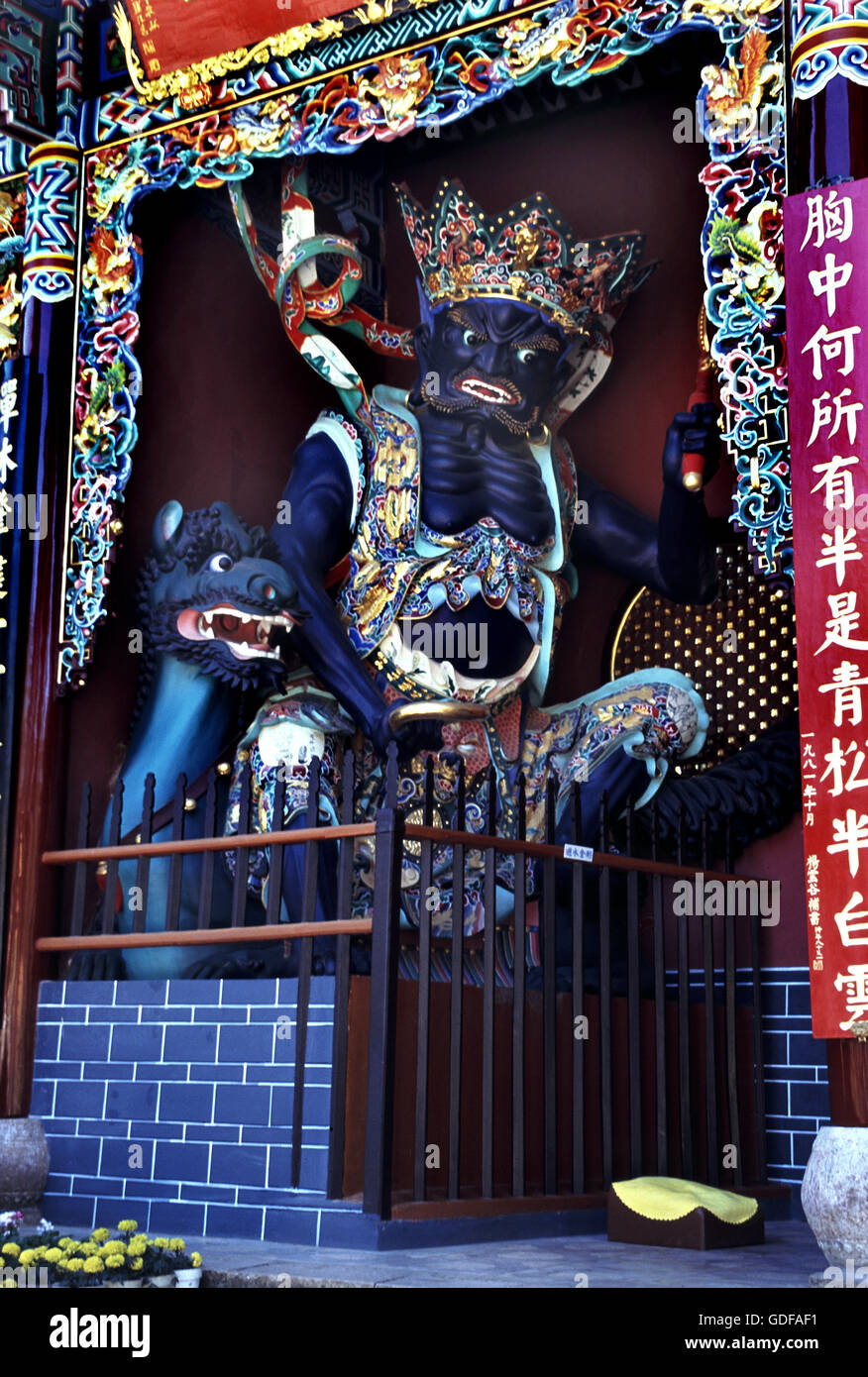 A ferocious god at the entrance to the Huatang Temple near Kunming in ...