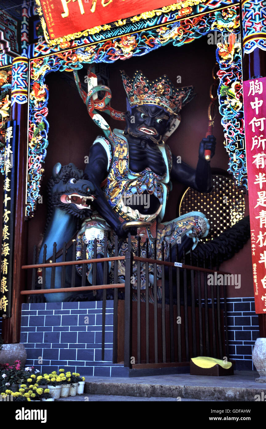 A ferocious god at the entrance to the Huatang Temple near Kunming in ...
