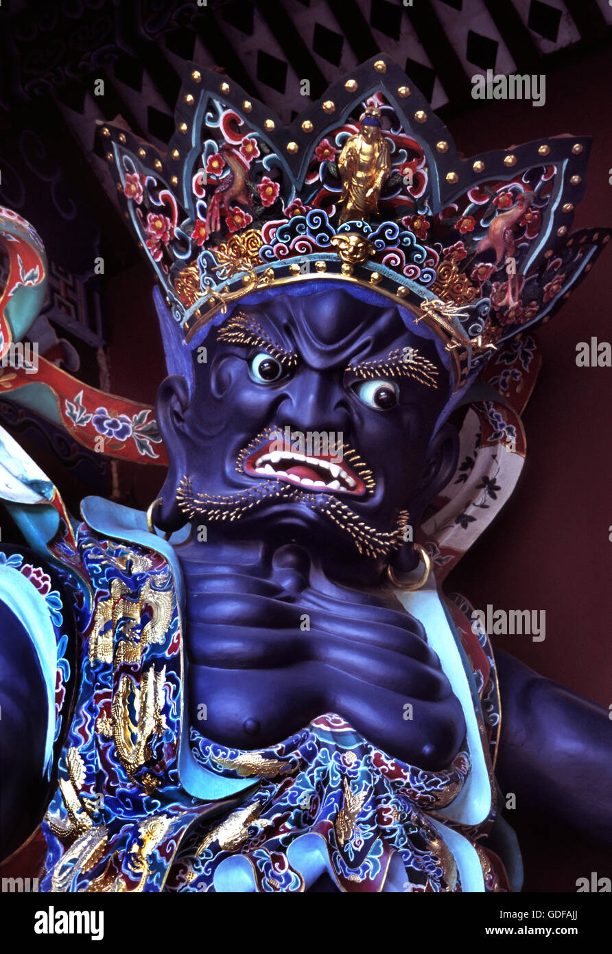 A ferocious god at the entrance to the Huatang Temple near Kunming in ...