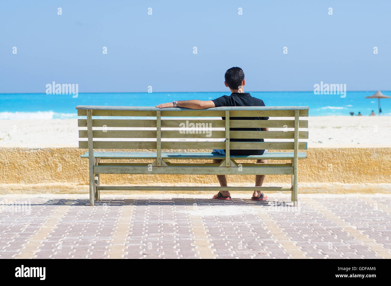 Man sitting chair sea hi-res stock photography and images - Alamy