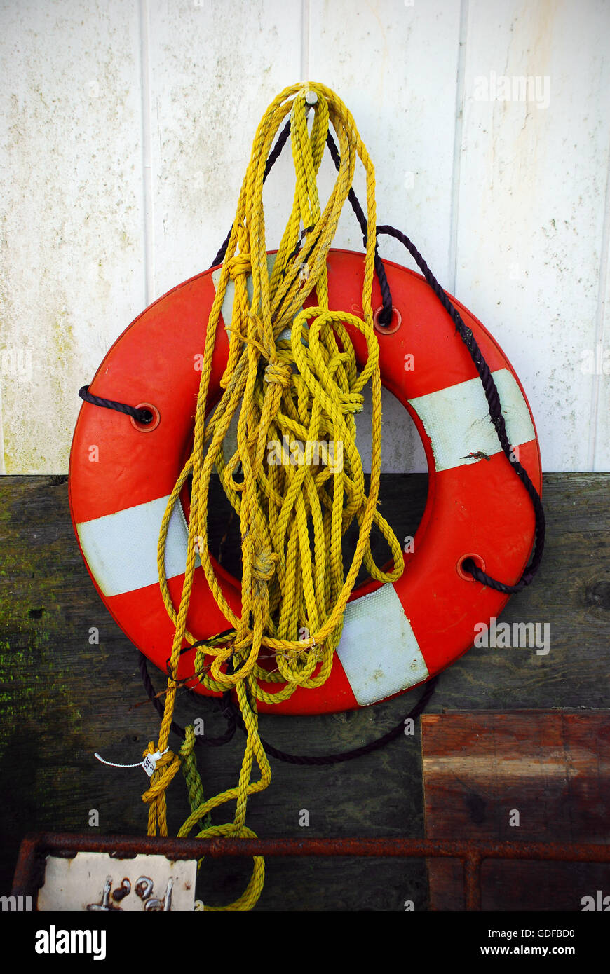 Red life preserver with rope Stock Photo - Alamy