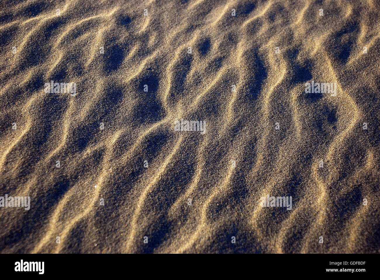 Ripples of sand on beach Stock Photo - Alamy