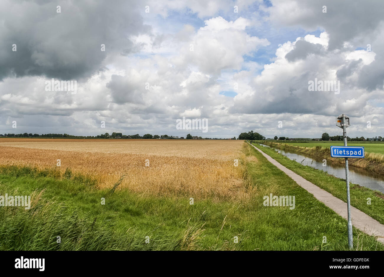 Bicycle path through dutch landscape in Groningen Stock Photo - Alamy