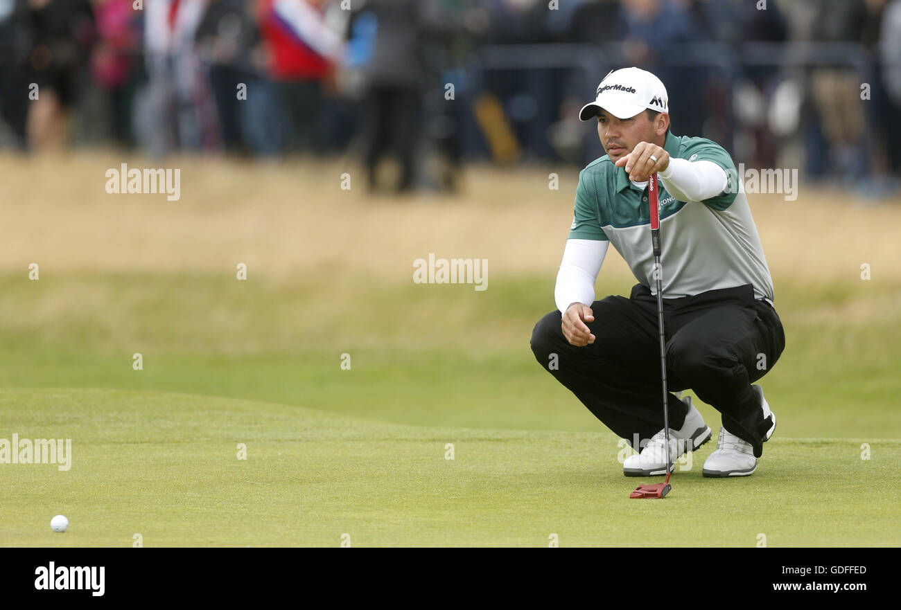 Australia's Jason Day lines up a putt on the first green during day ...