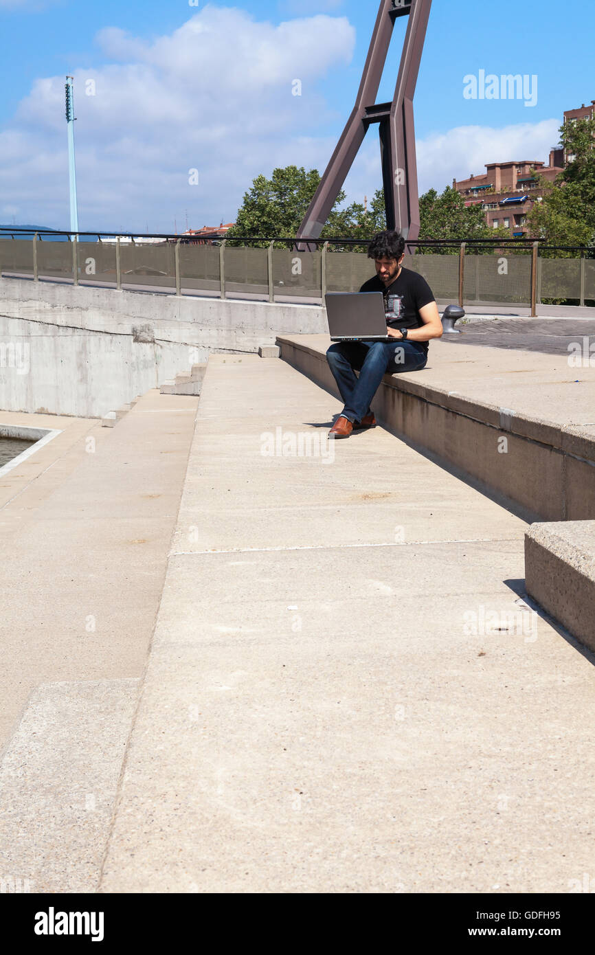 Man working outside the office Stock Photo - Alamy