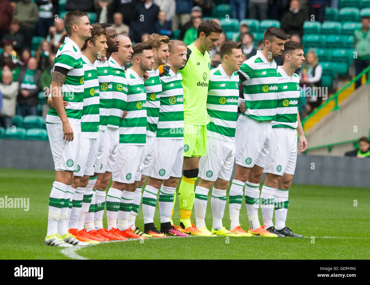 Celtic players stand for a minutes silence in memory of the Nice ...