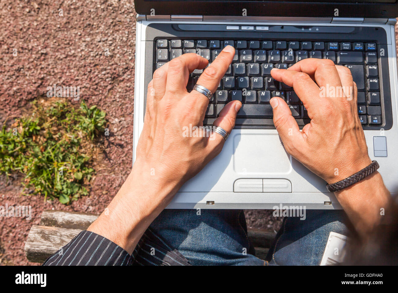 Human hands typing a laptop Stock Photo - Alamy