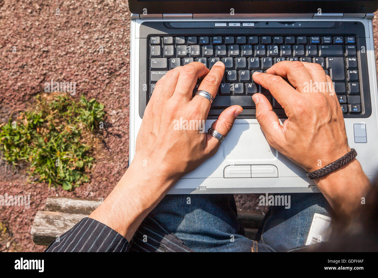 Human hands typing a laptop Stock Photo - Alamy