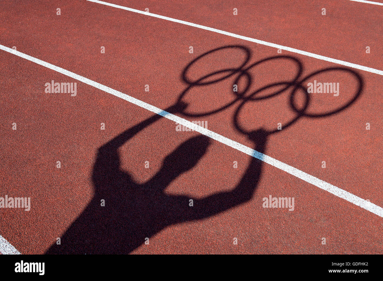 RIO DE JANEIRO - FEBRUARY 12, 2015: Shadow of an athlete holds Olympic ...