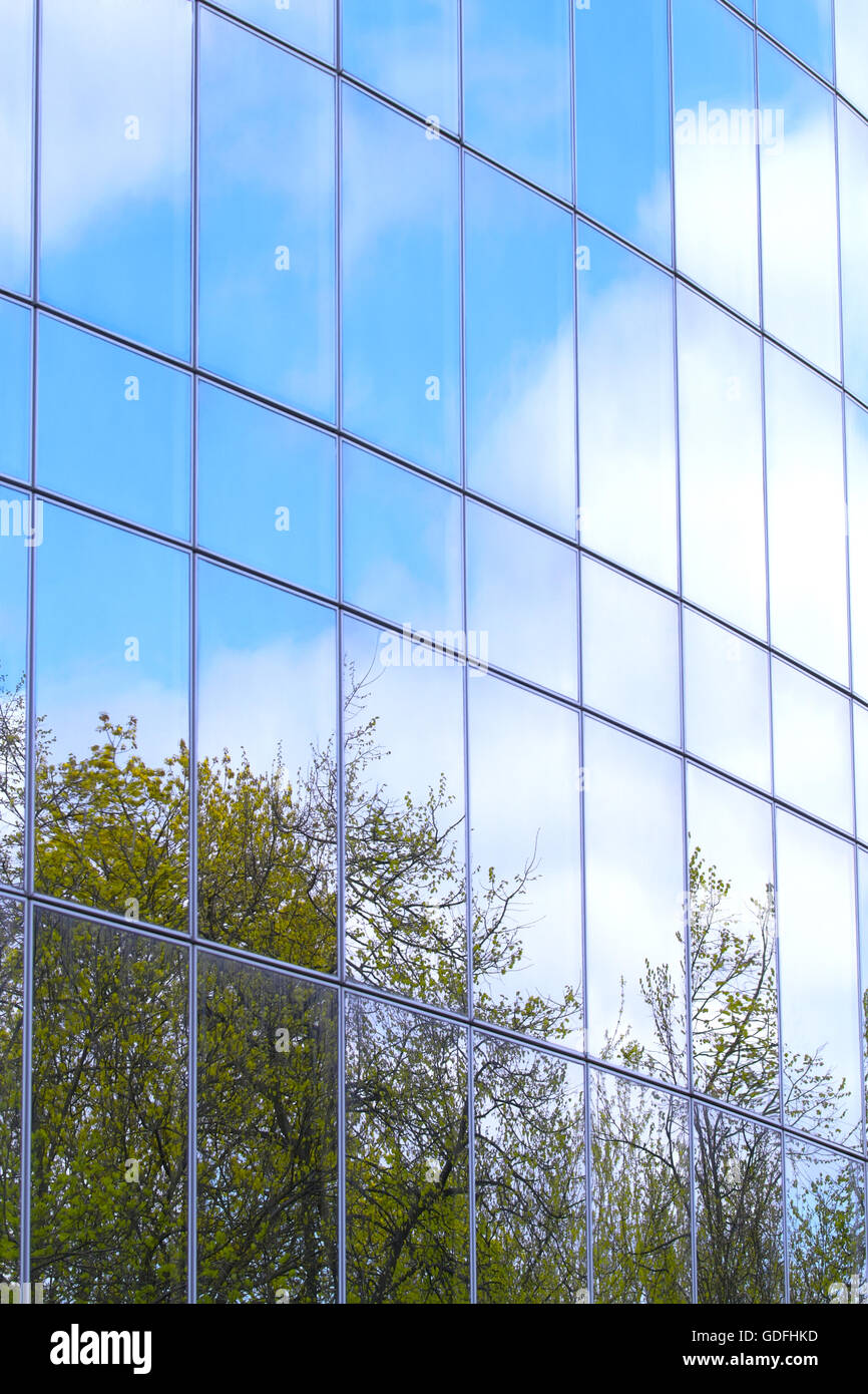 Tree reflected in glass building hi-res stock photography and images ...