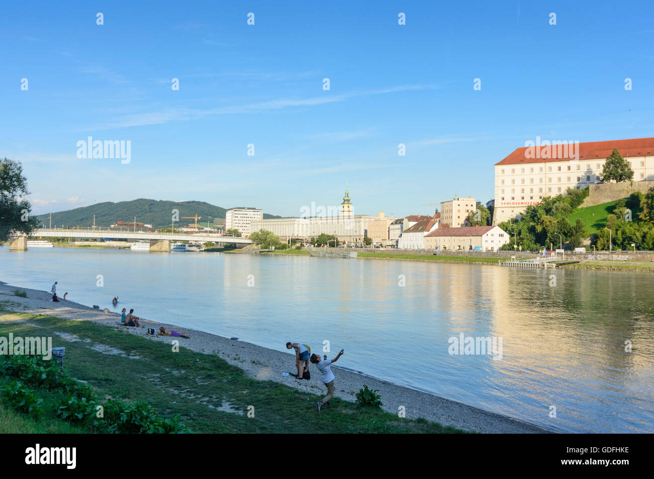Linz: Castle and Nibelungenbrücke with bathers in the Danube, Austria ...