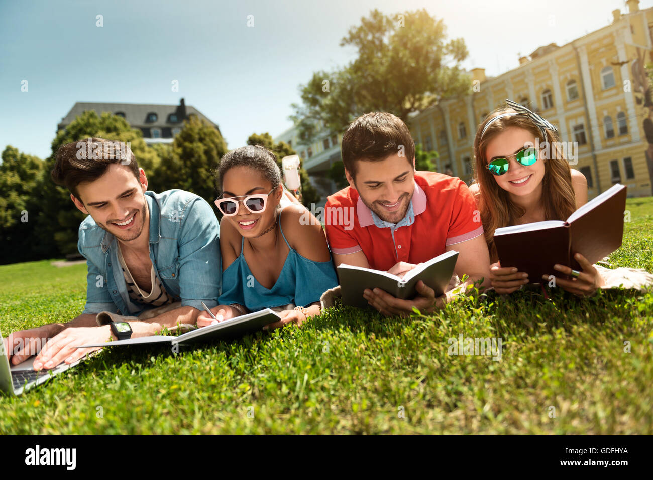 Modern youth studying outdoors Stock Photo - Alamy