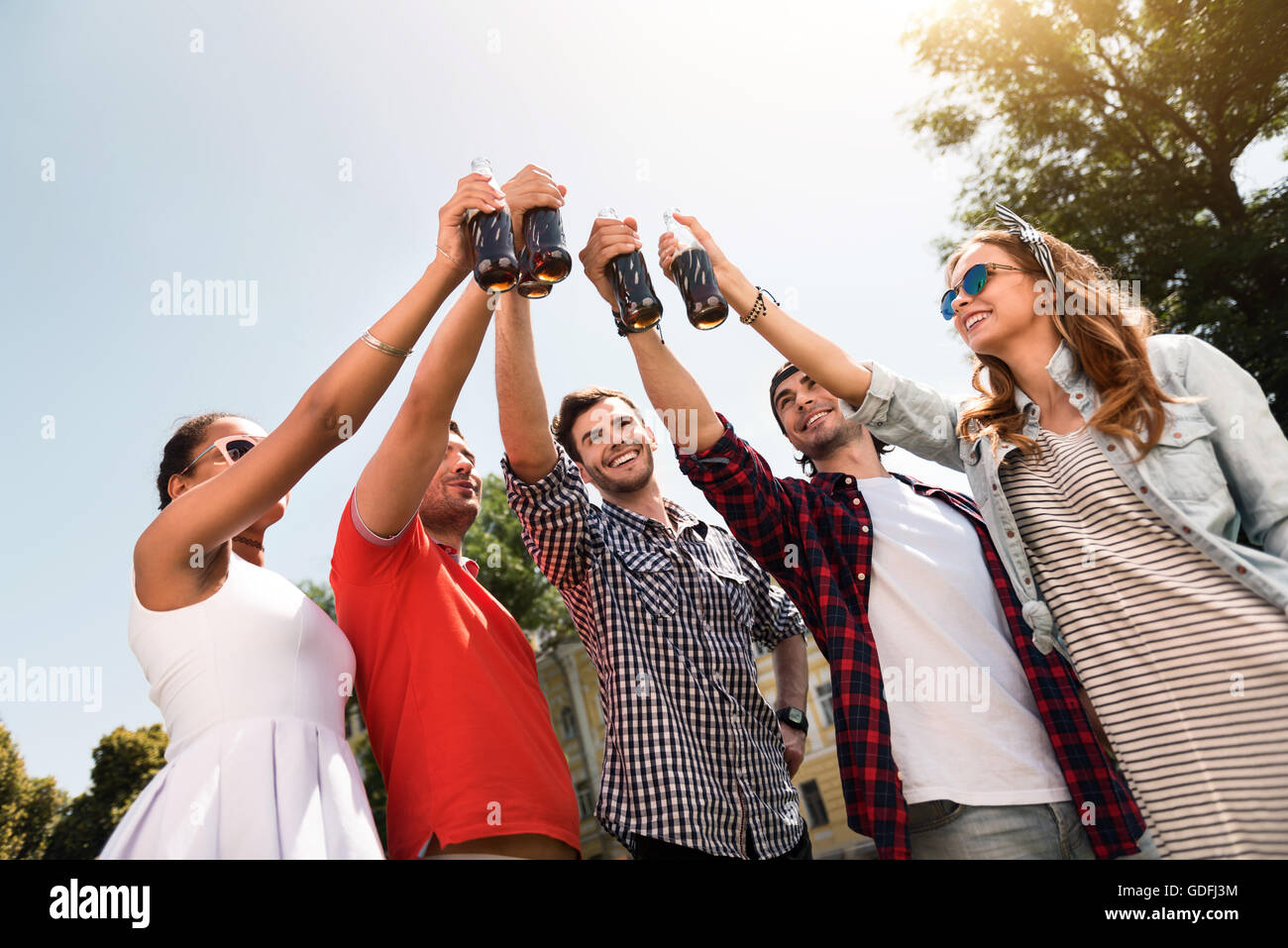 Modern youth relaxing outdoors Stock Photo - Alamy