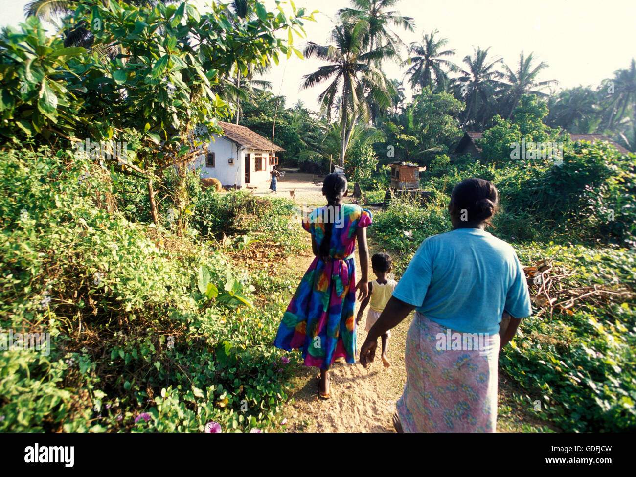 people at their home in the town of Hikkaduwa in the southwest of Sri ...