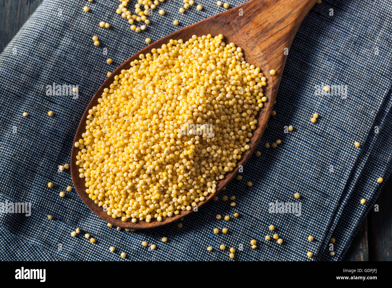 Raw Organic Healthy Millet in a Spoon Stock Photo - Alamy
