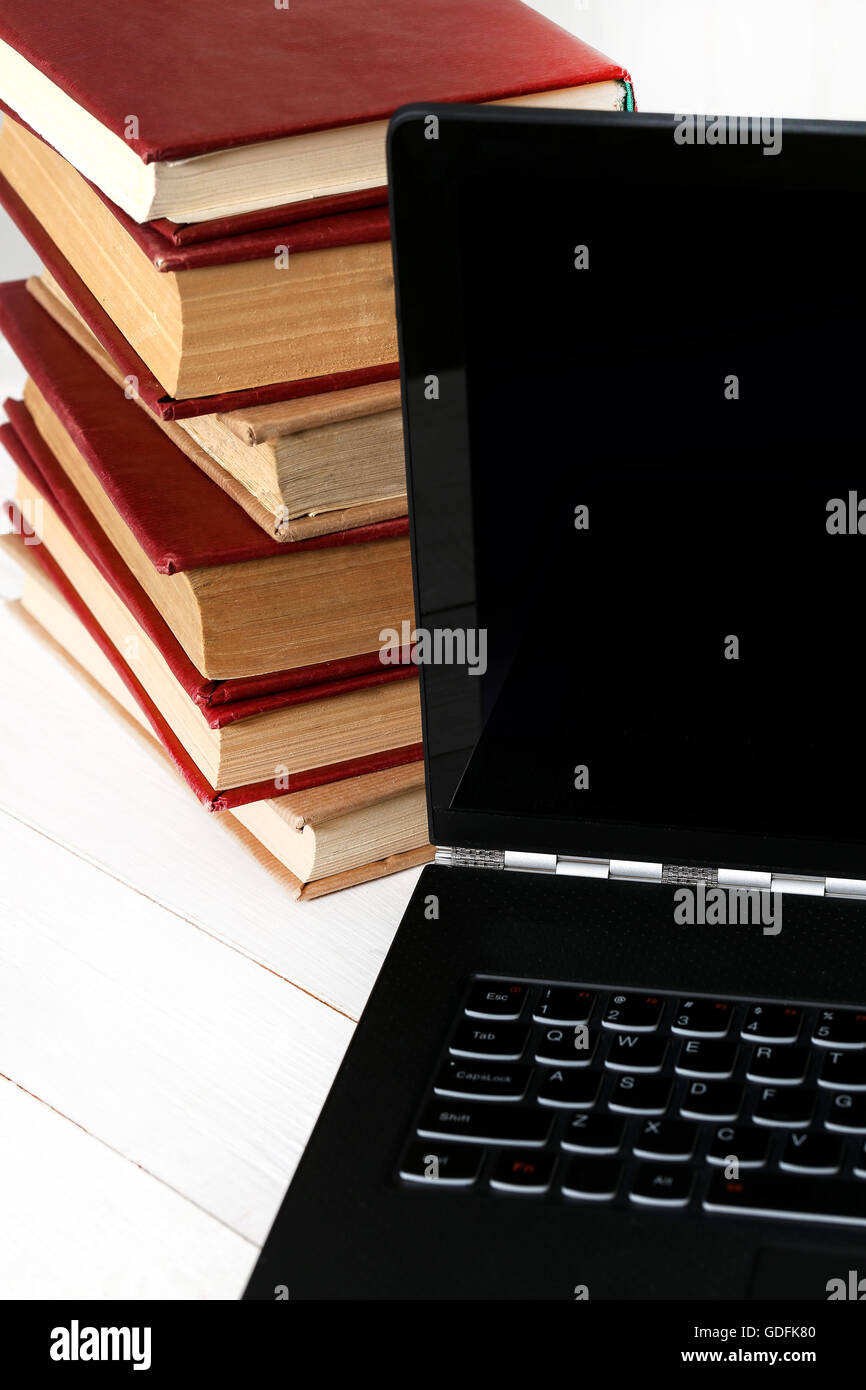 Stack of books and computer hi-res stock photography and images - Alamy