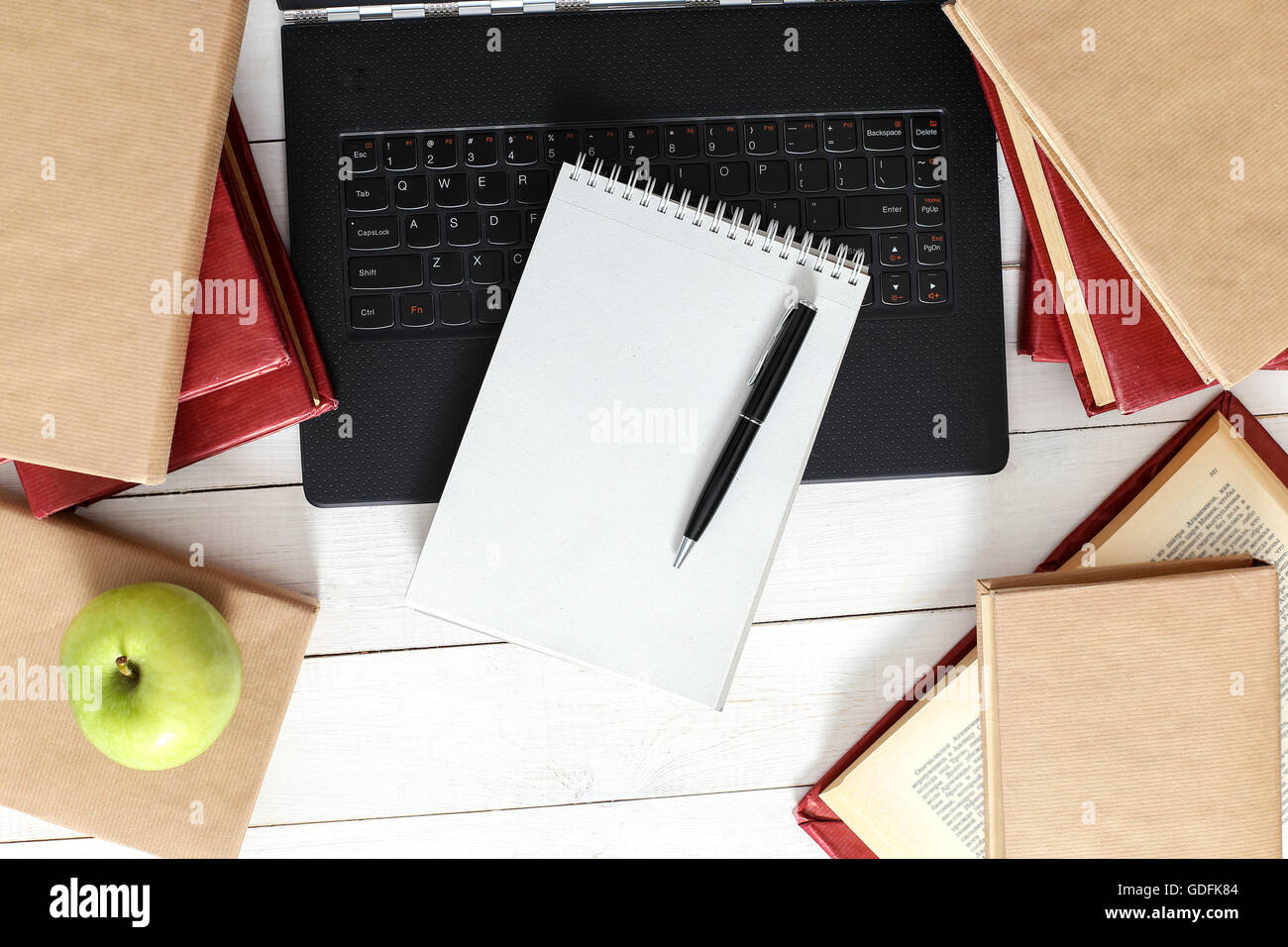 Books with laptop Stock Photo - Alamy