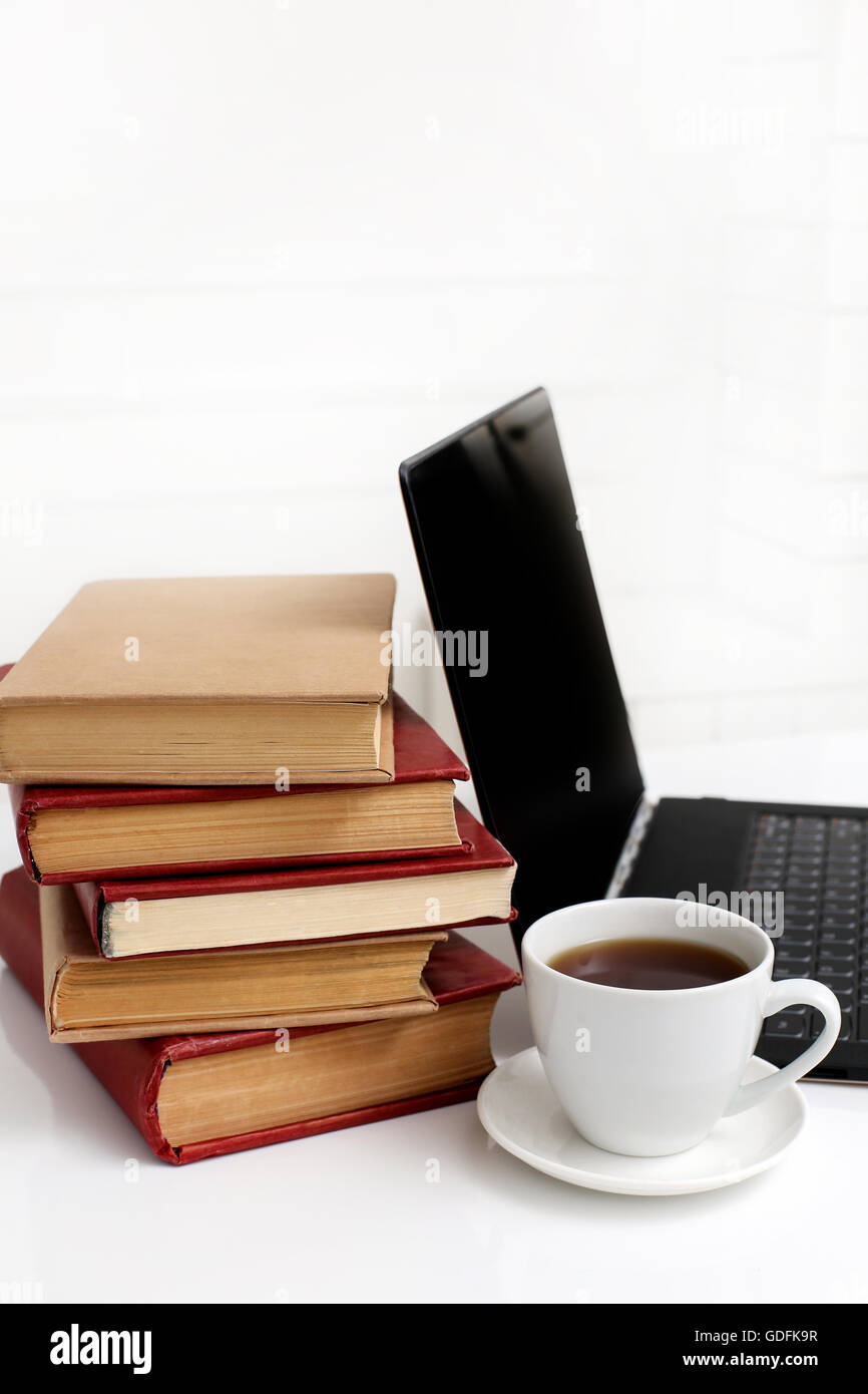 Books with laptop Stock Photo - Alamy
