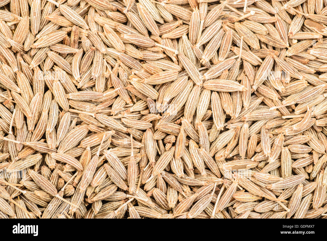 food background of cumin seeds Stock Photo - Alamy