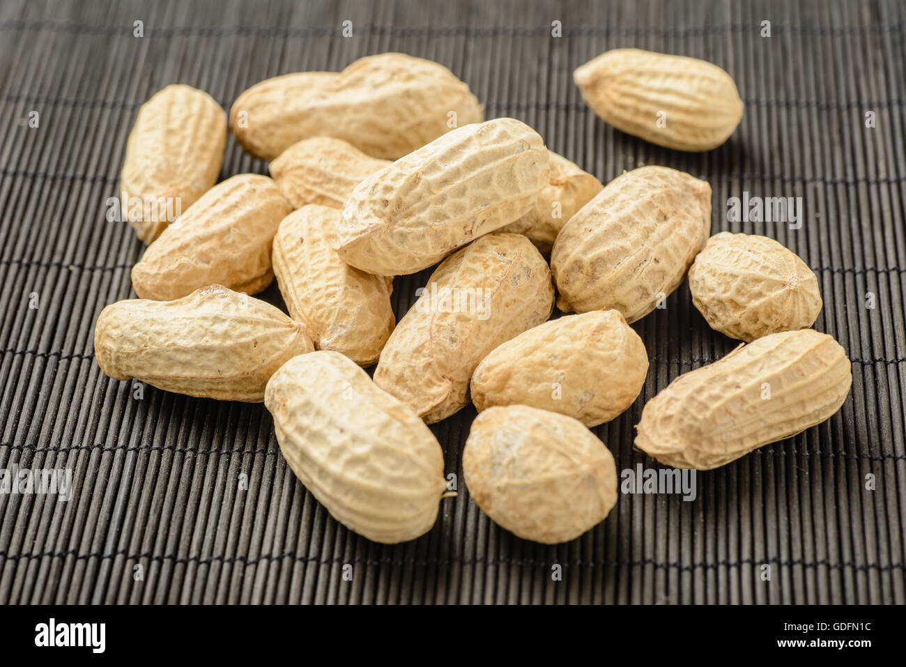 peanuts on the bamboo mat Stock Photo - Alamy