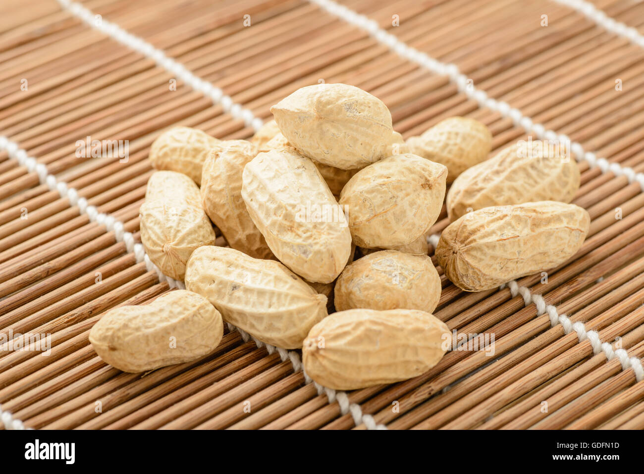 peanuts on the bamboo mat Stock Photo - Alamy