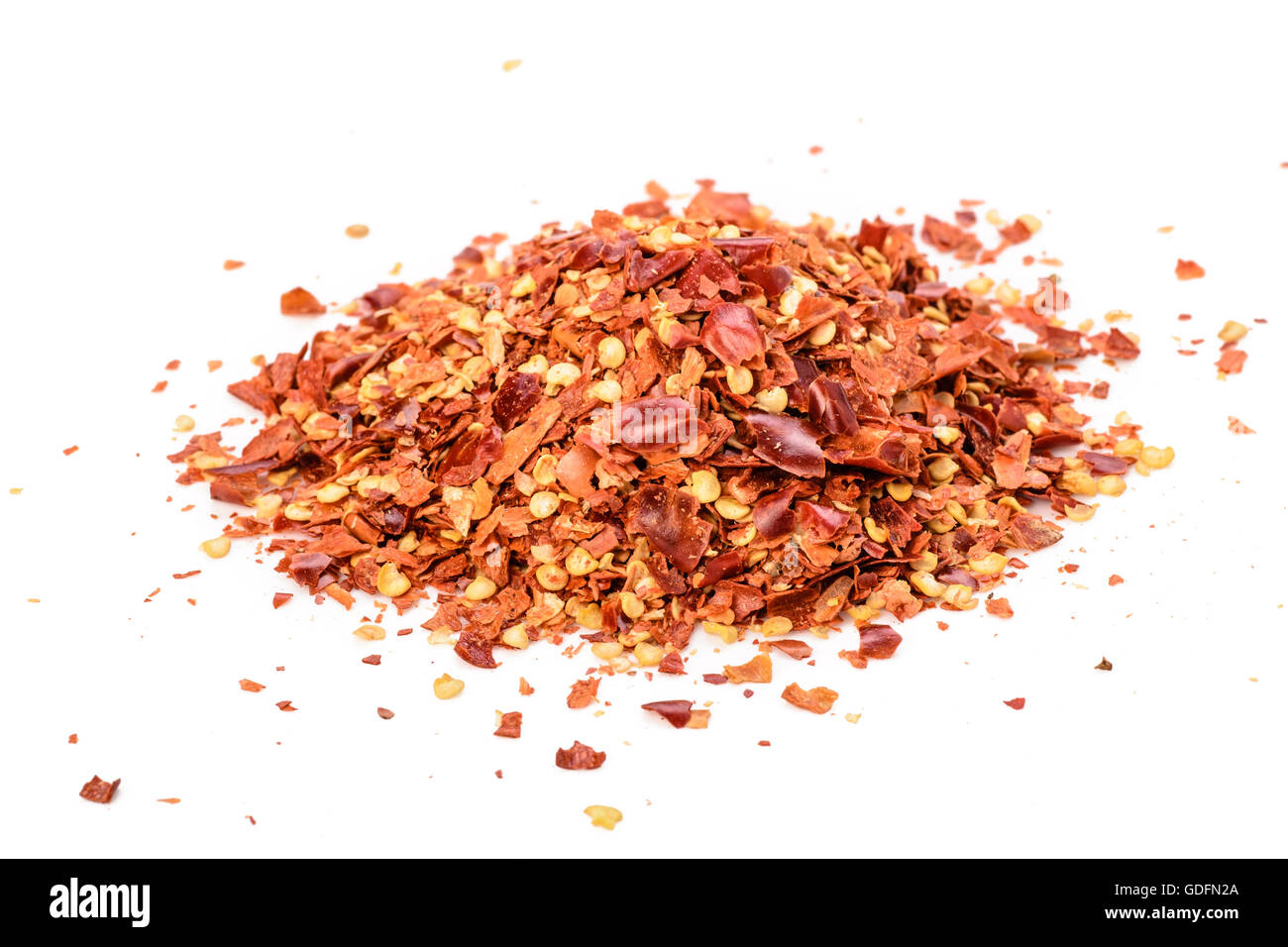 red chilli flakes on the white background Stock Photo - Alamy