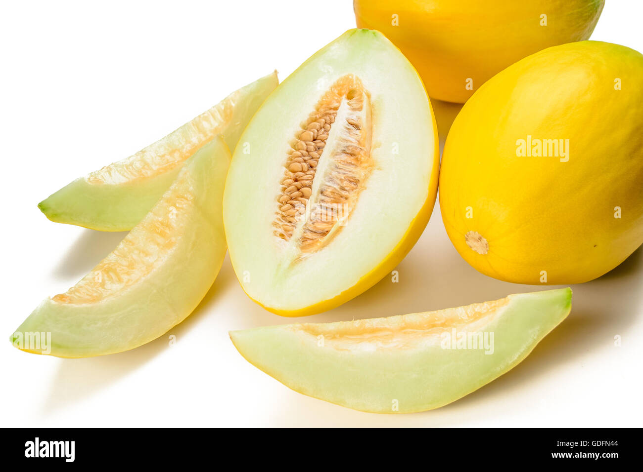 yellow melon slices on the white background Stock Photo - Alamy