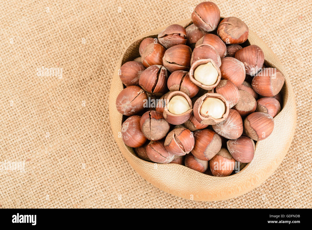 dried hazelnut in the wooden bowl Stock Photo - Alamy