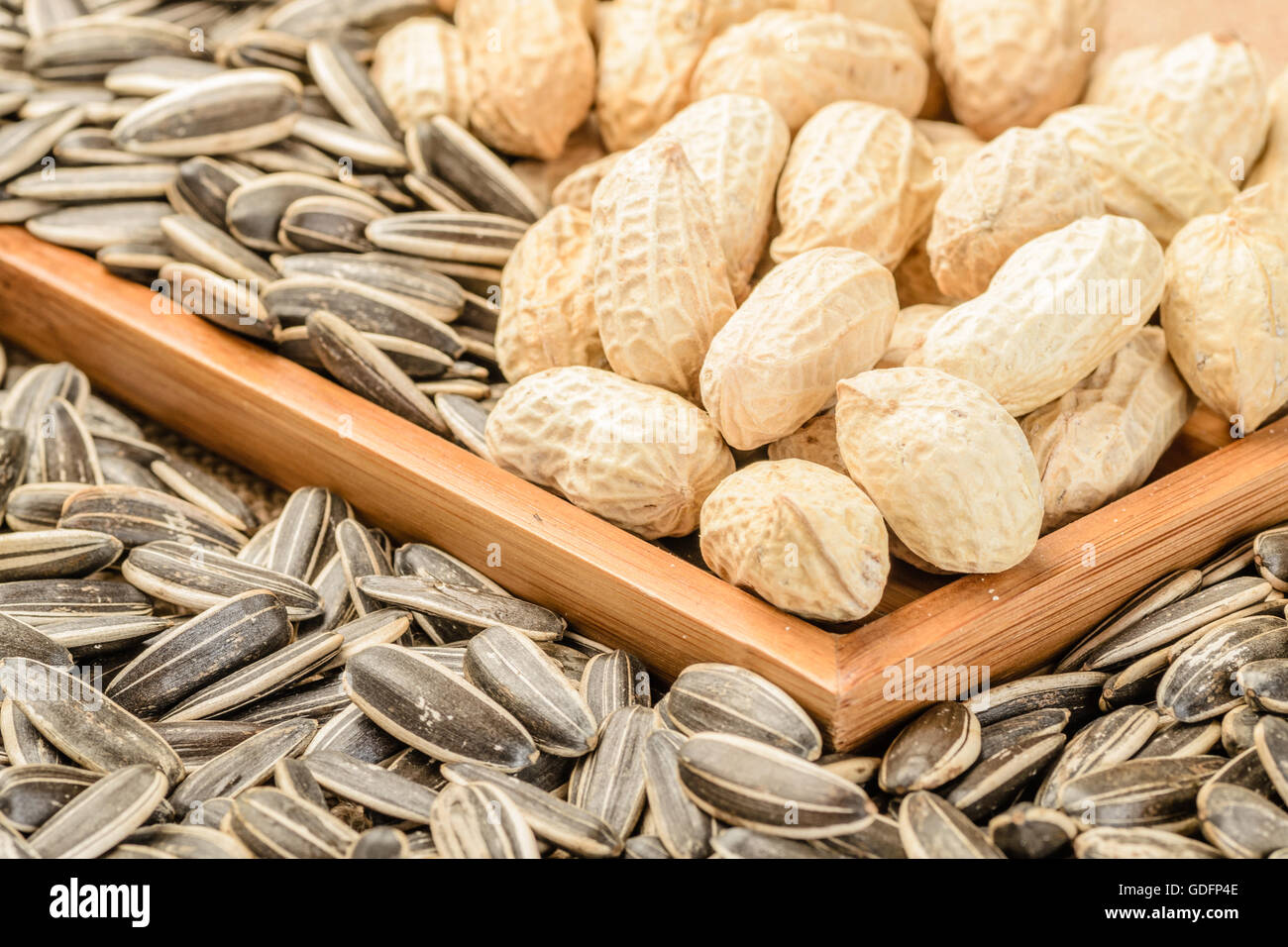 baked sunflower seeds and peanuts on the linen tablecloth Stock Photo ...