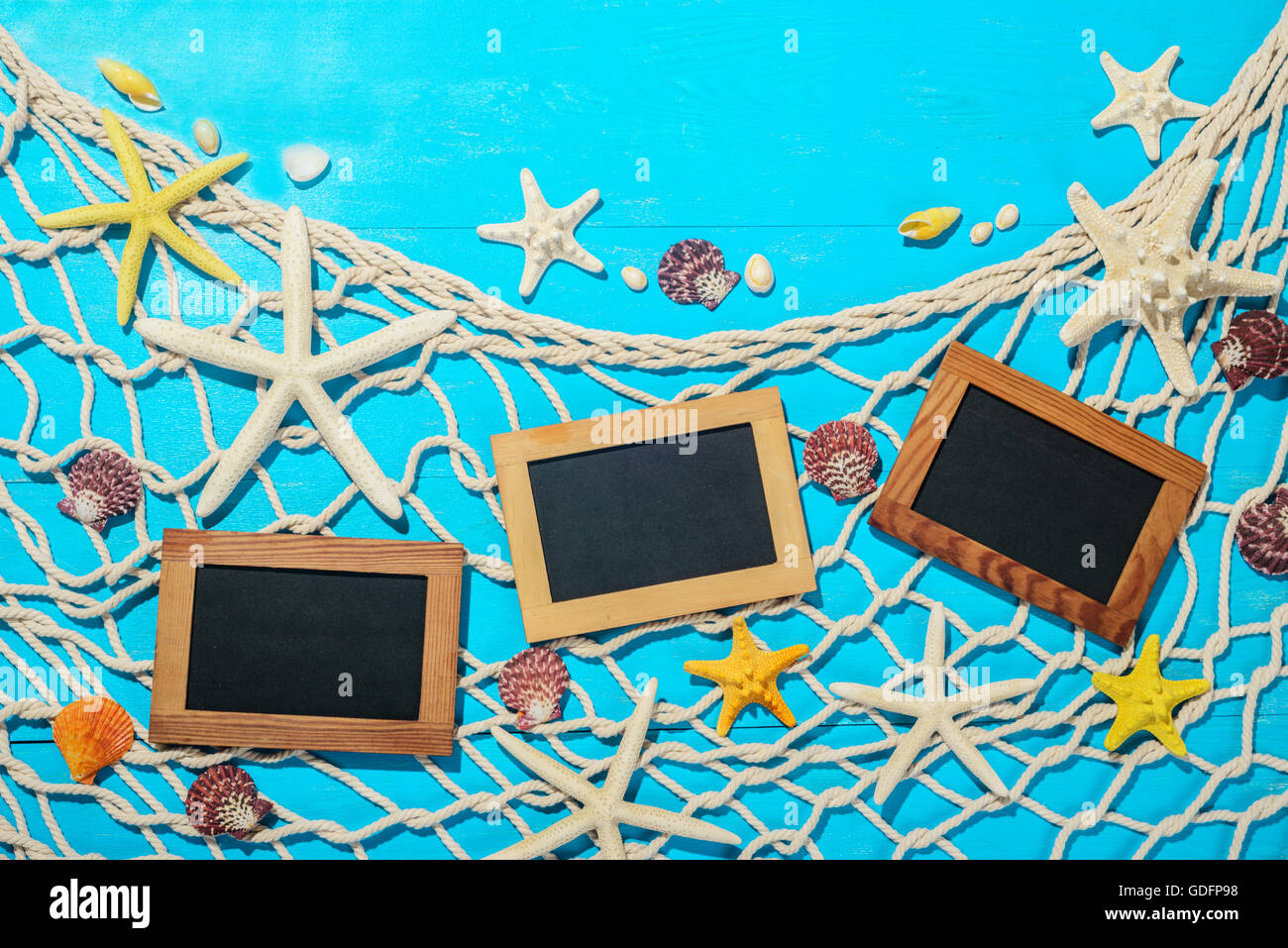 photo frames and starfish on the blue background Stock Photo - Alamy