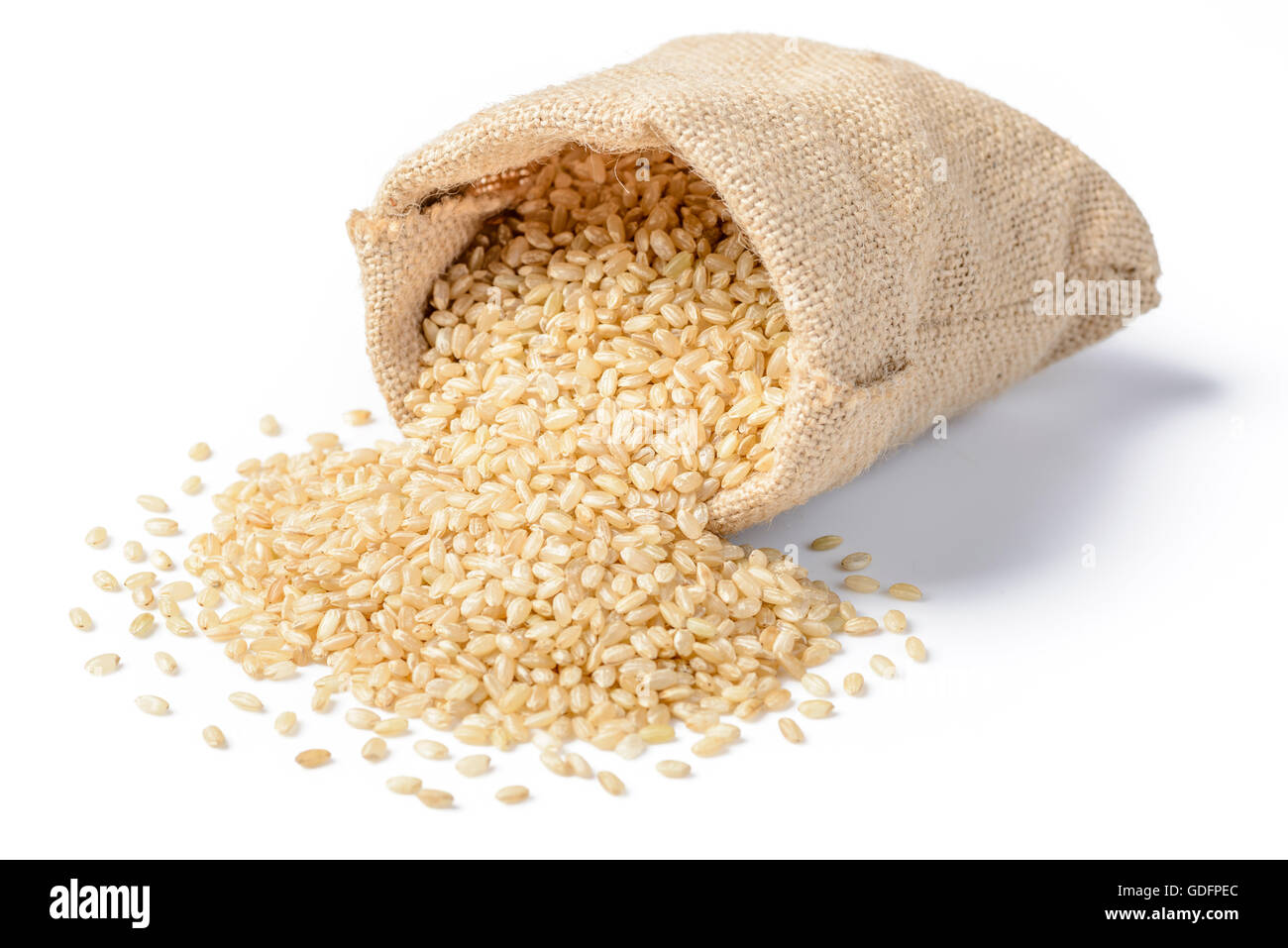 brown rice on the white background Stock Photo - Alamy