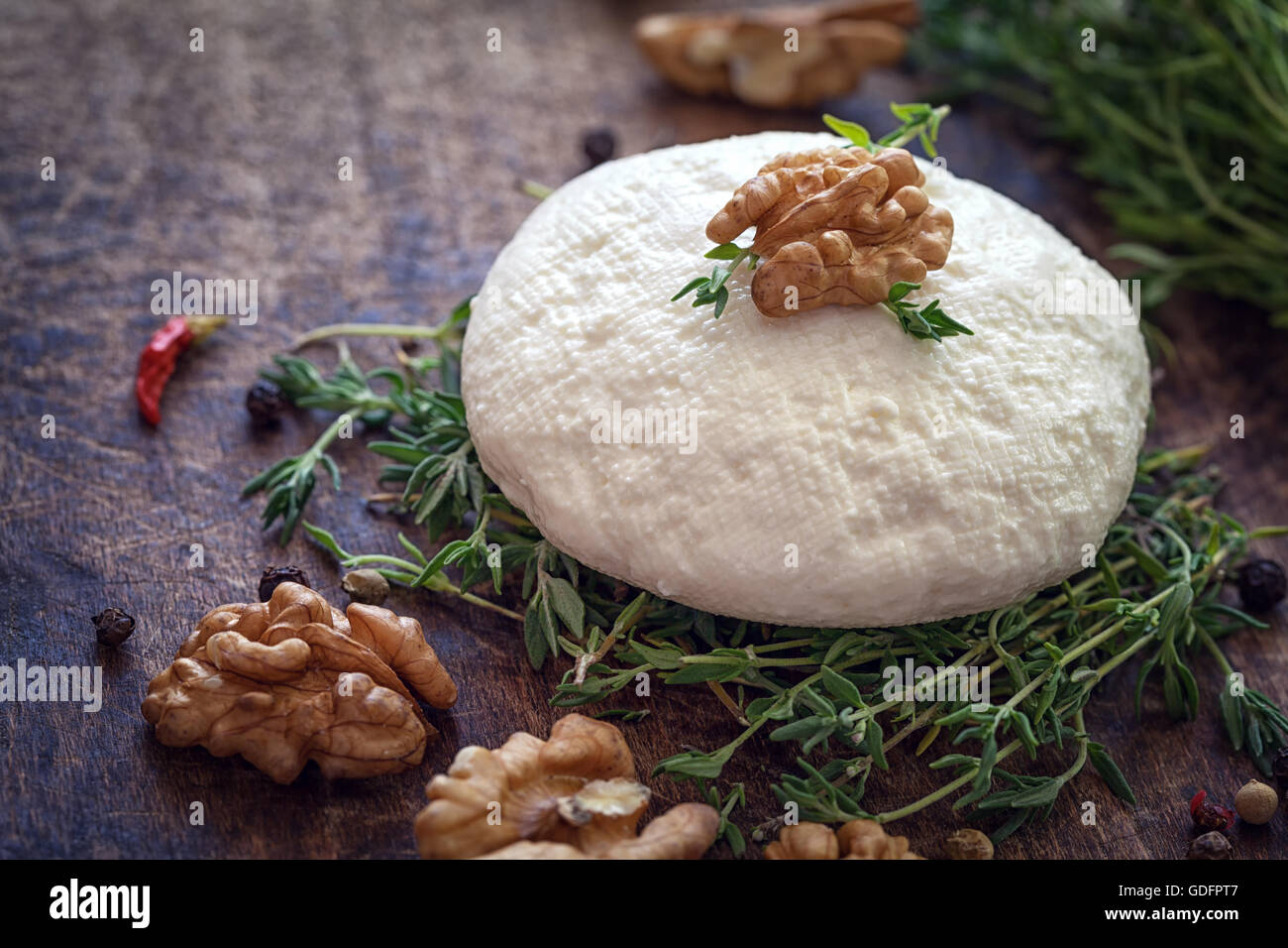 Goat cheese with honey, thyme and nuts Stock Photo - Alamy