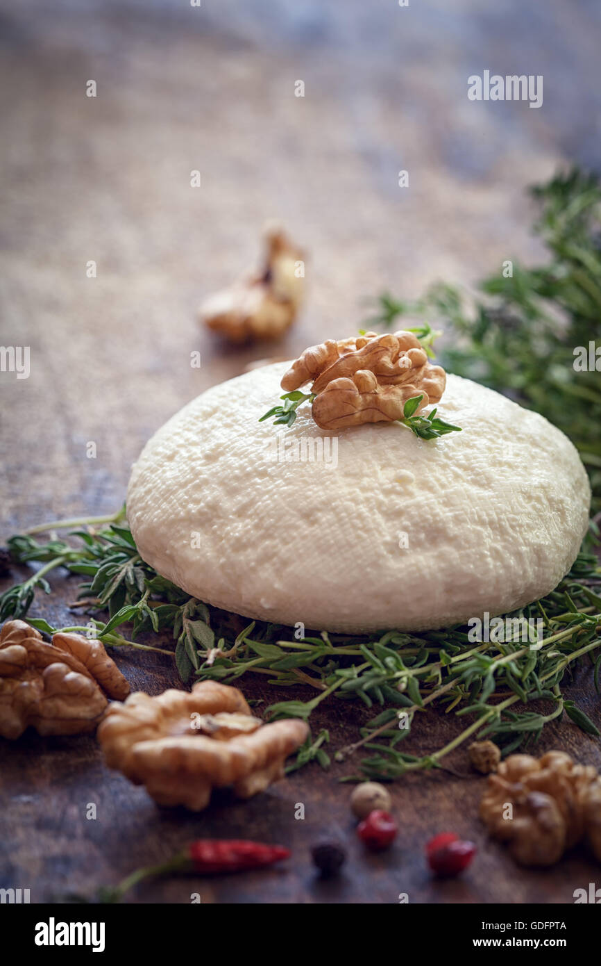 Goat cheese with honey, thyme and nuts Stock Photo - Alamy
