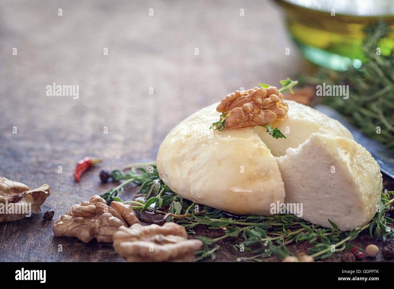 Goat cheese with honey, thyme and nuts Stock Photo - Alamy