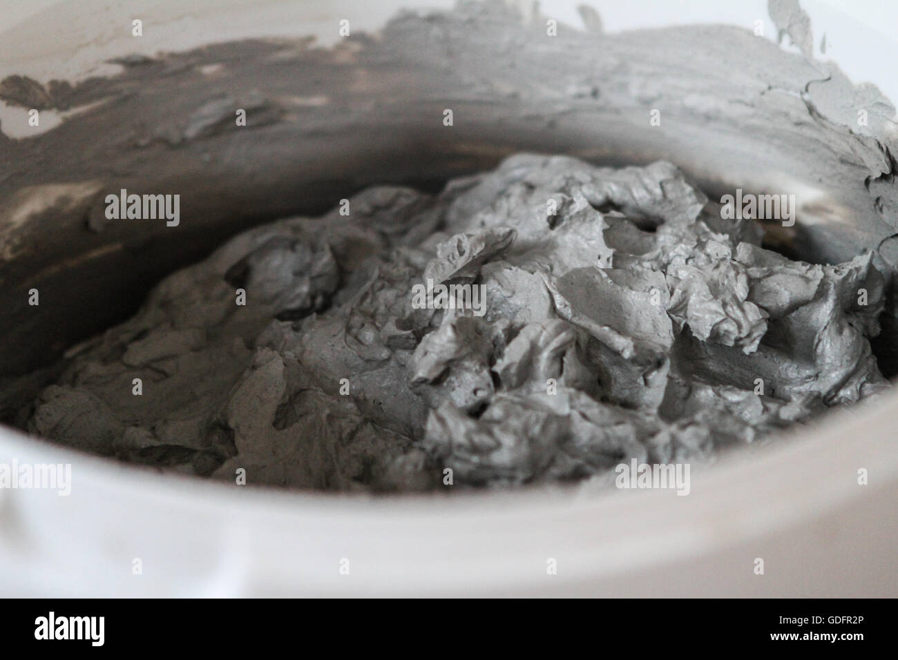 clay mingled in plastic bucket at pottery Stock Photo - Alamy