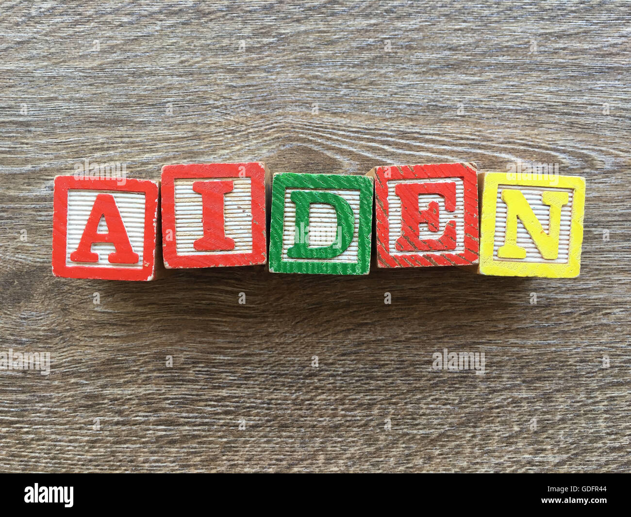 Aiden name written with wood block letter toys Stock Photo - Alamy