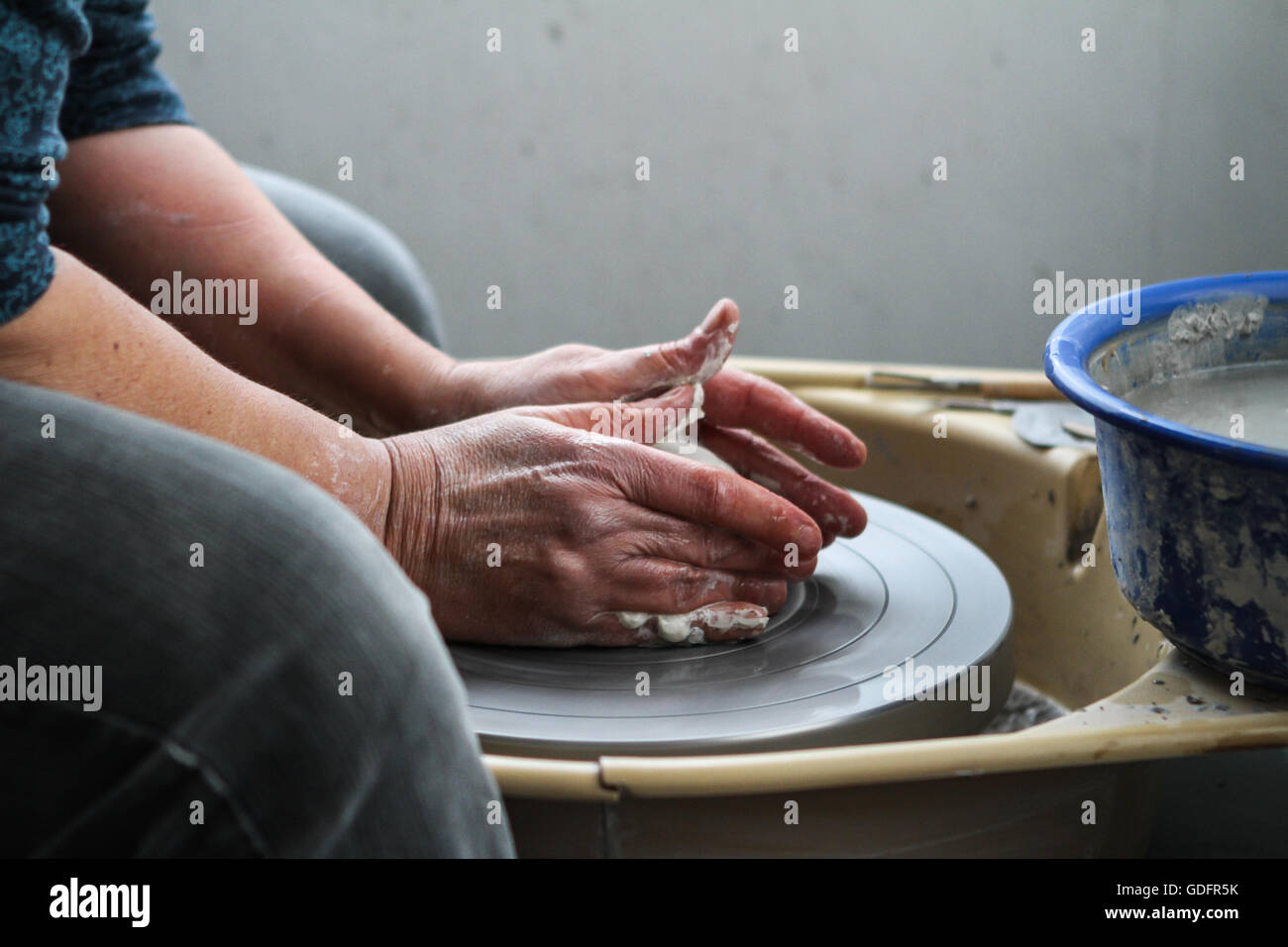 The Potter Tempering The Clay at pottery Stock Photo - Alamy