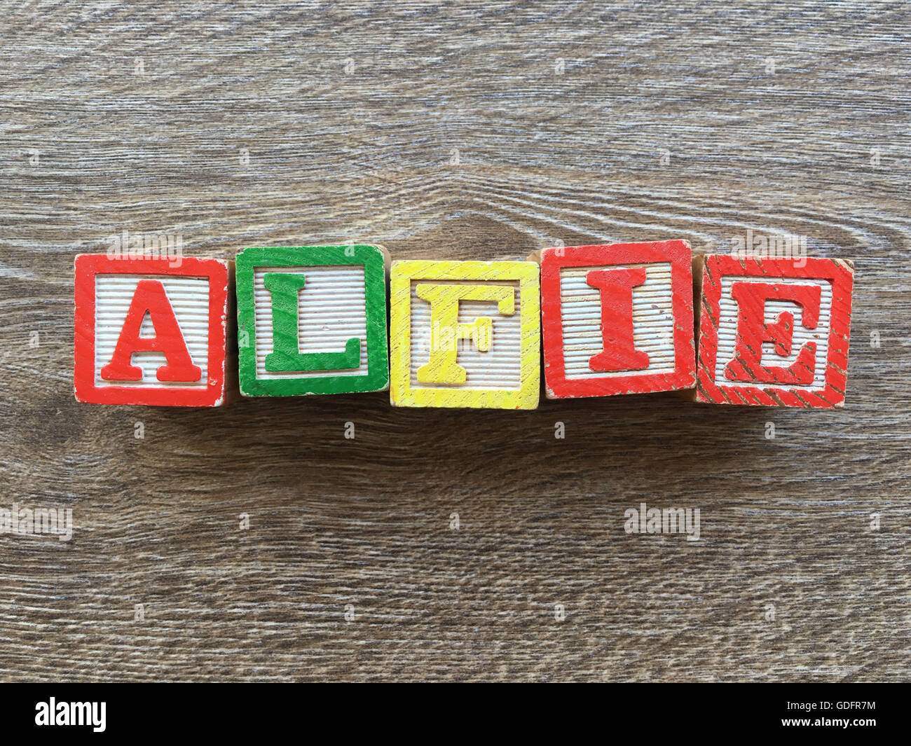 Alfie name written with wood block letter toys Stock Photo - Alamy