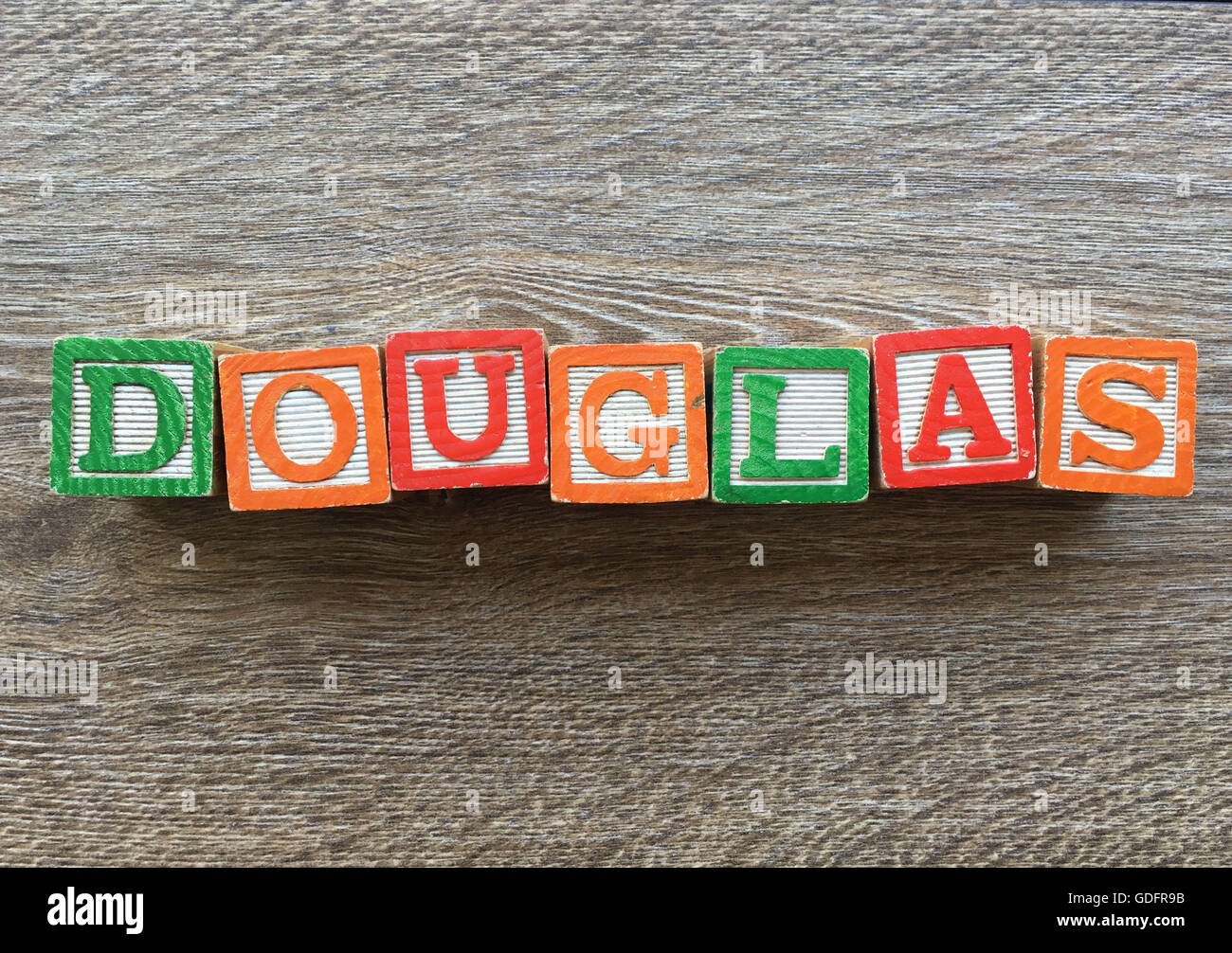 Douglas name written with wood block letter toys Stock Photo - Alamy