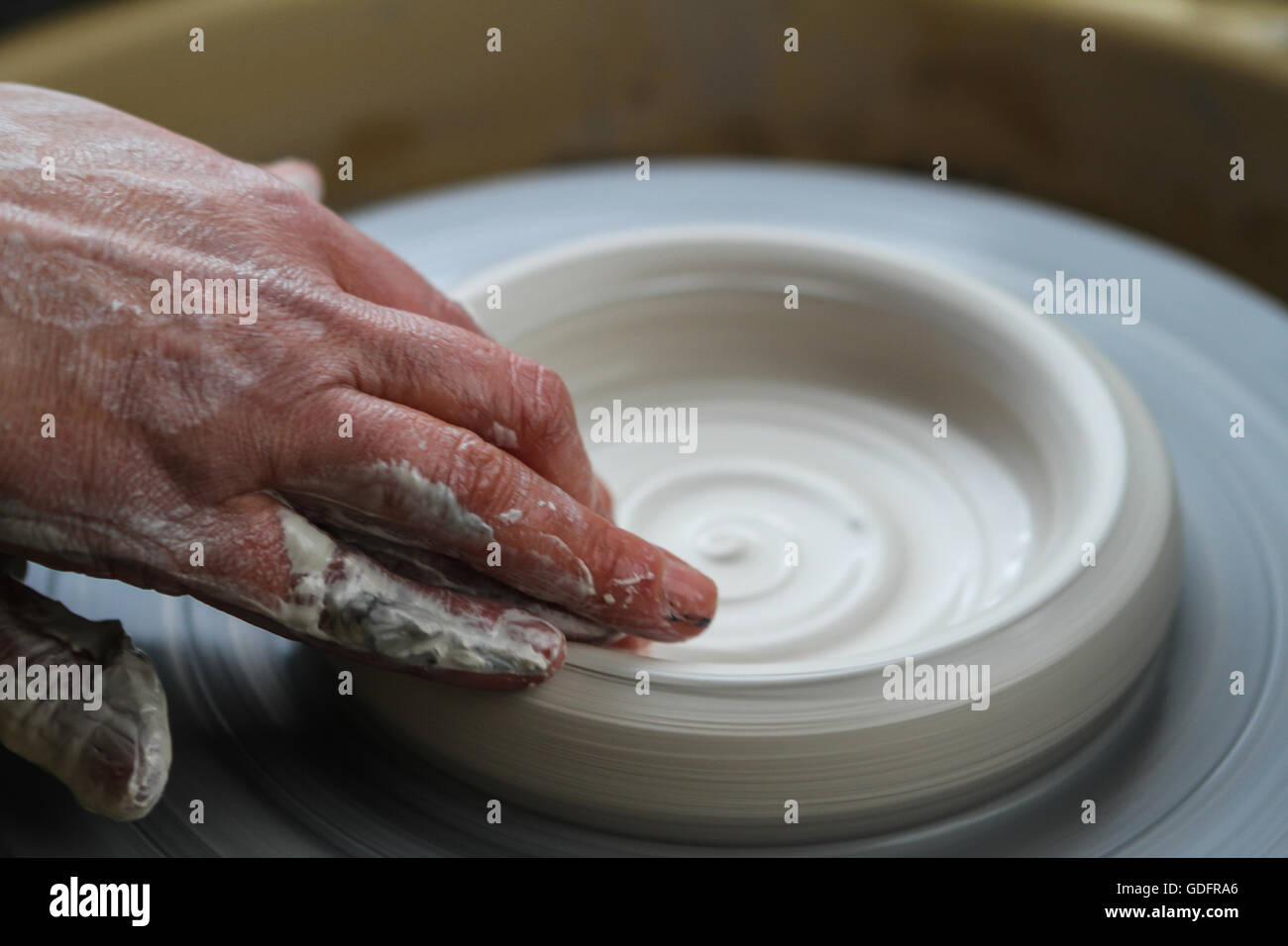 Potter works. Crockery creation process in pottery on potters' wheel ...