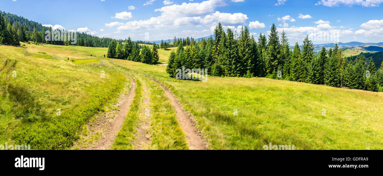 composite panoramic image mountain landscape. curve path through the ...