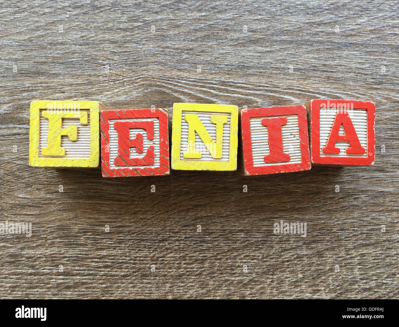 Fenia name written with wood block letter toys Stock Photo - Alamy