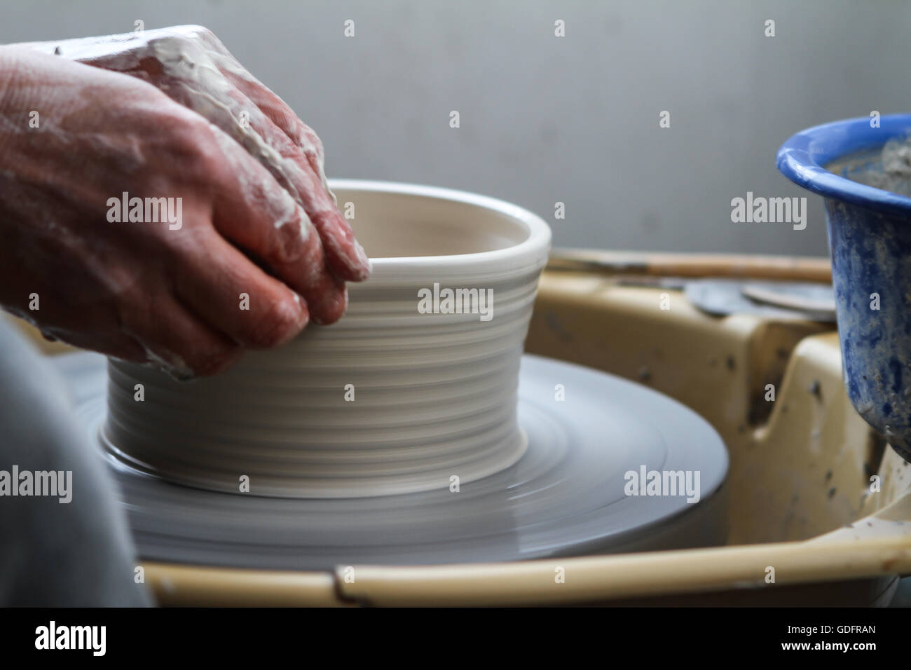 hands of a potter creating ceramic on the circle Stock Photo - Alamy