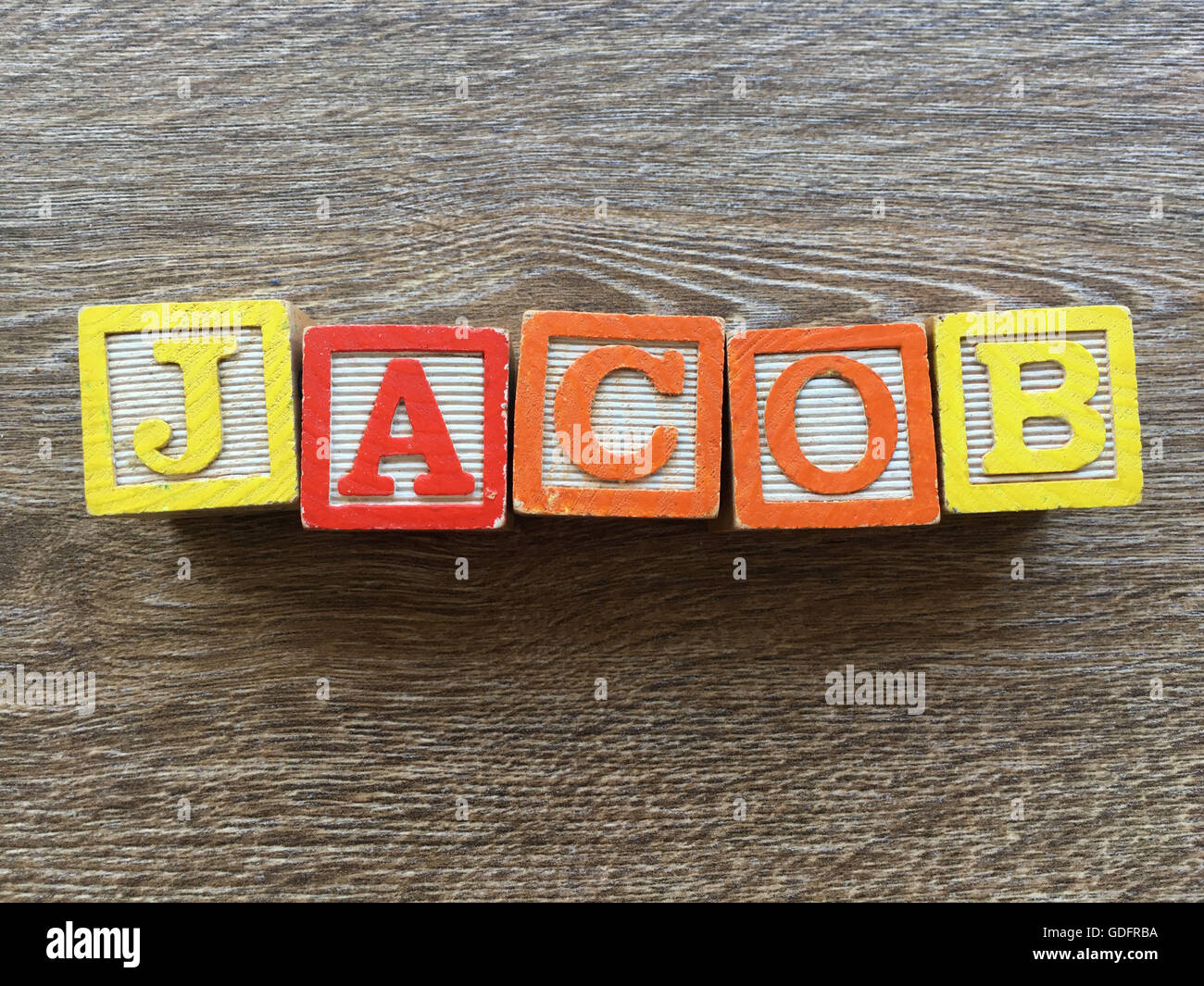 Jacob name written with wood block letter toys Stock Photo - Alamy