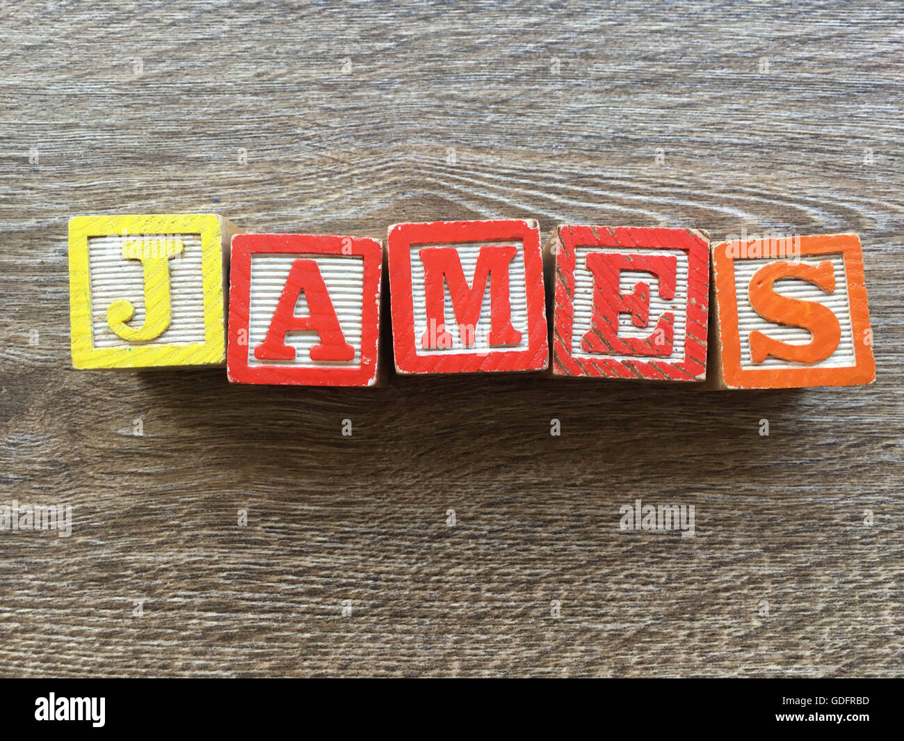 James name written with wood block letter toys Stock Photo - Alamy