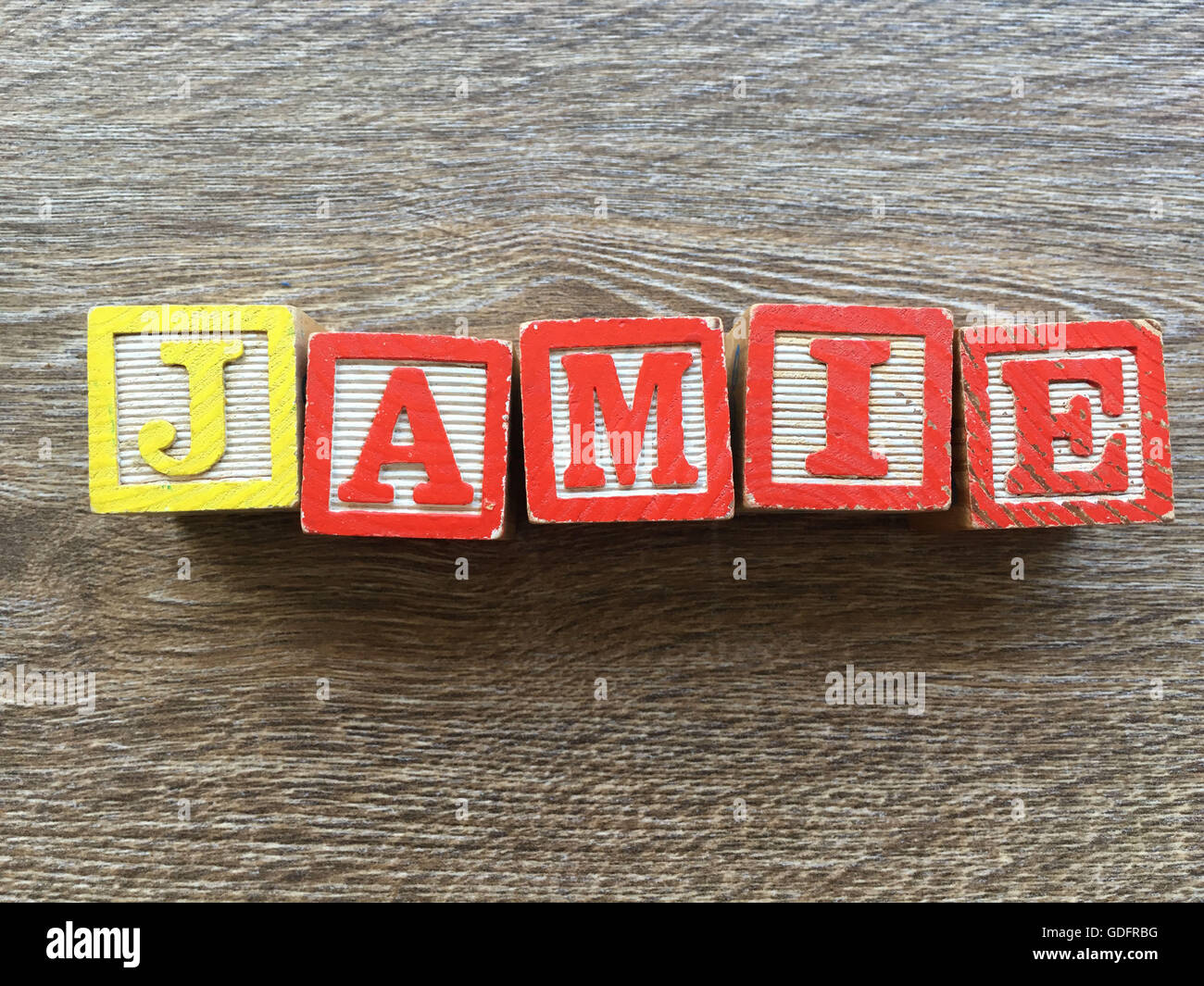 jamie name written with wood block letter toys Stock Photo - Alamy