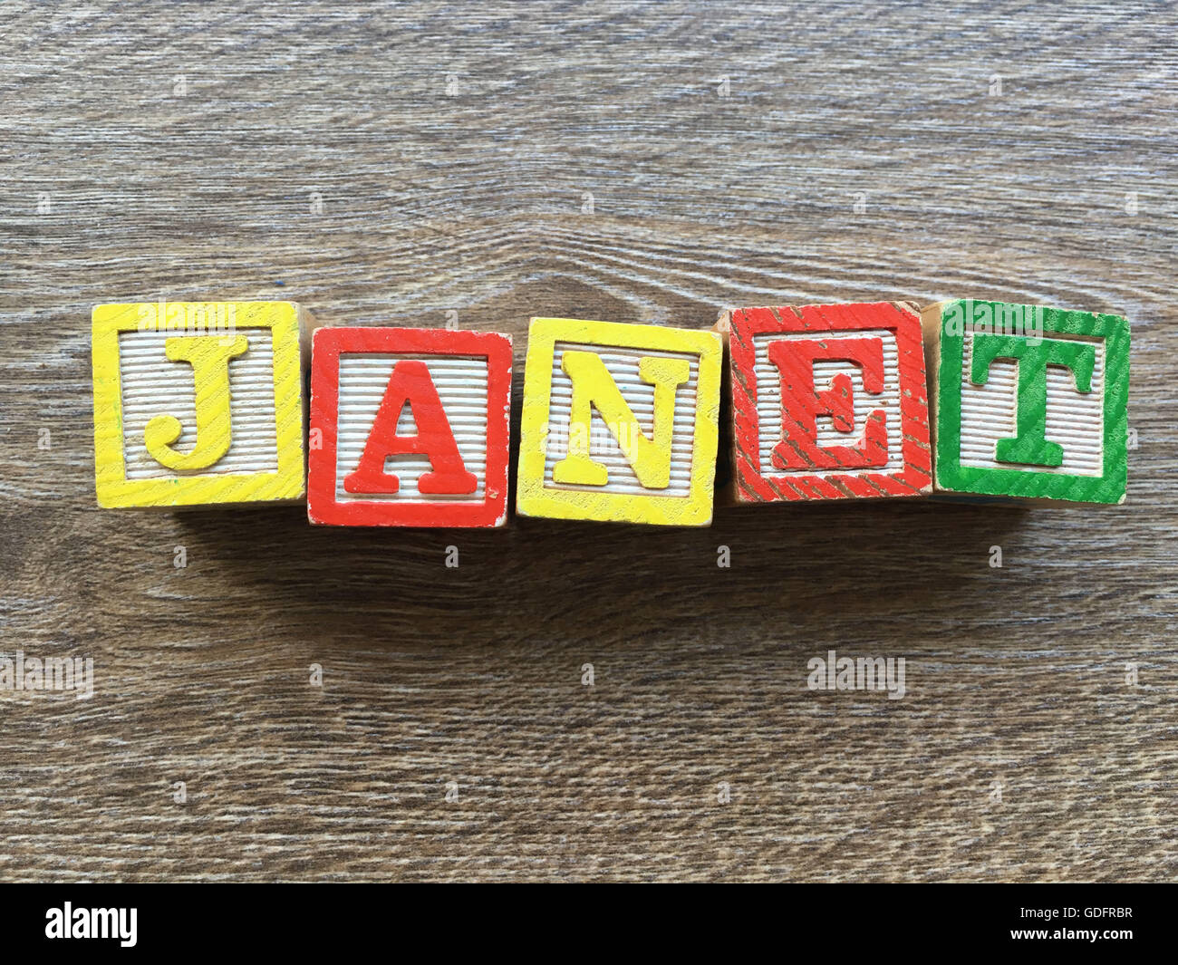 Janet name written with wood block letter toys Stock Photo - Alamy