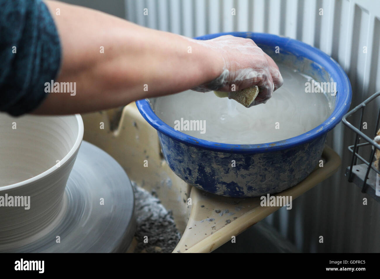 Potter works. Crockery creation process in pottery on potters' wheel ...