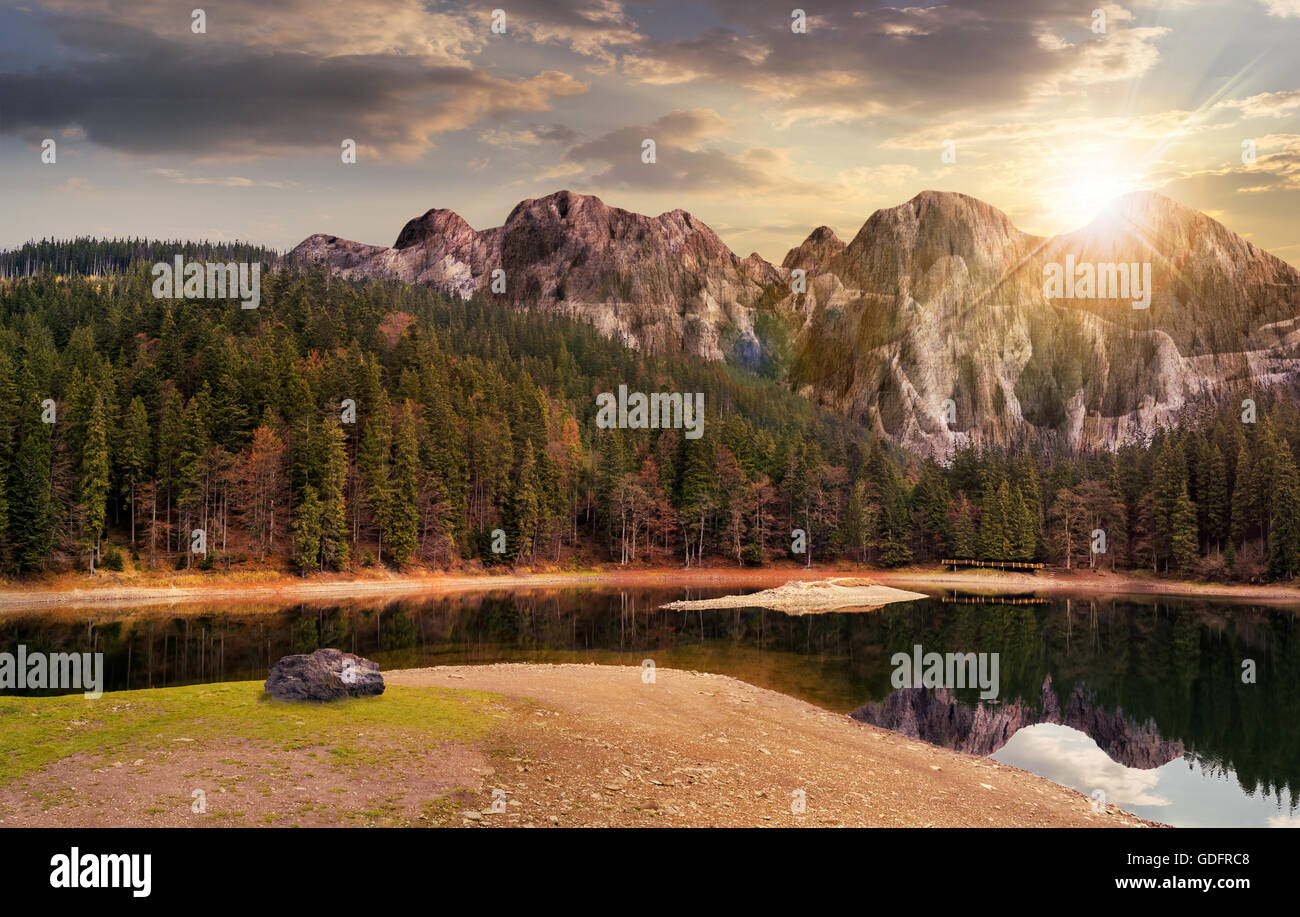 composite landscape with CGI elements. lake with boulder on the shore ...